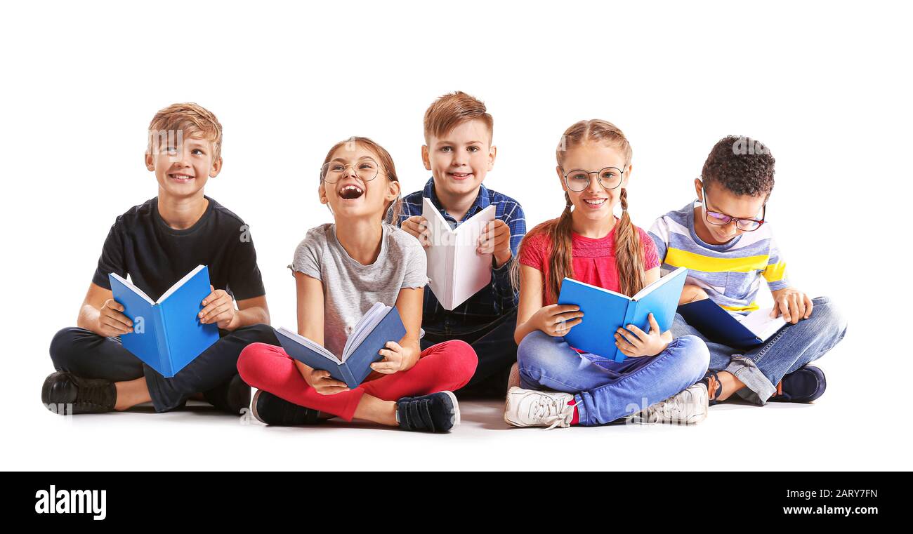 Cute little children reading books on white background Stock Photo - Alamy