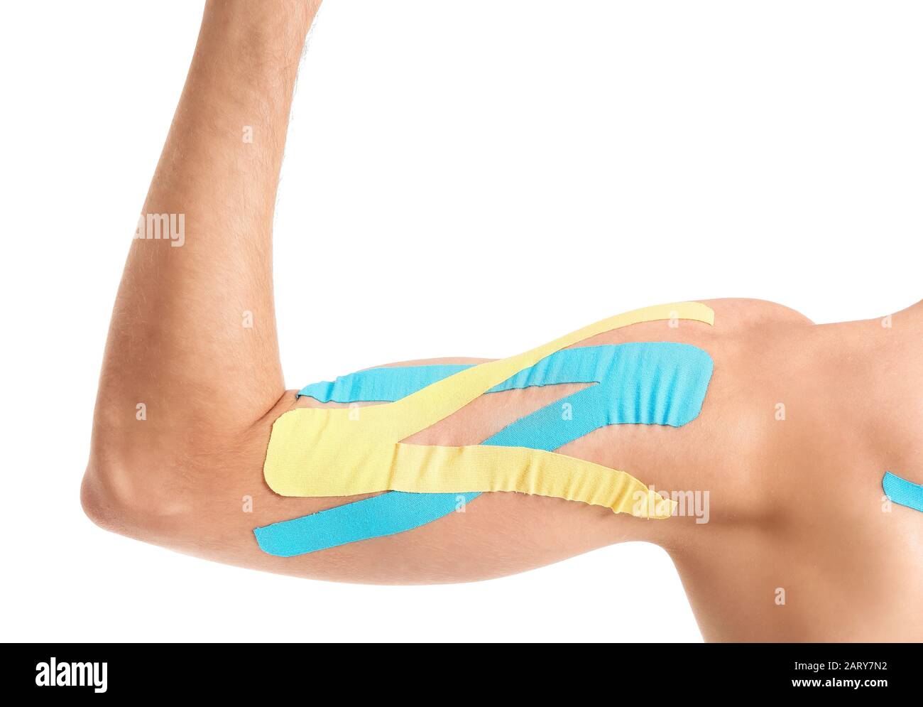 Sporty man with physio tape applied on arm against white background ...