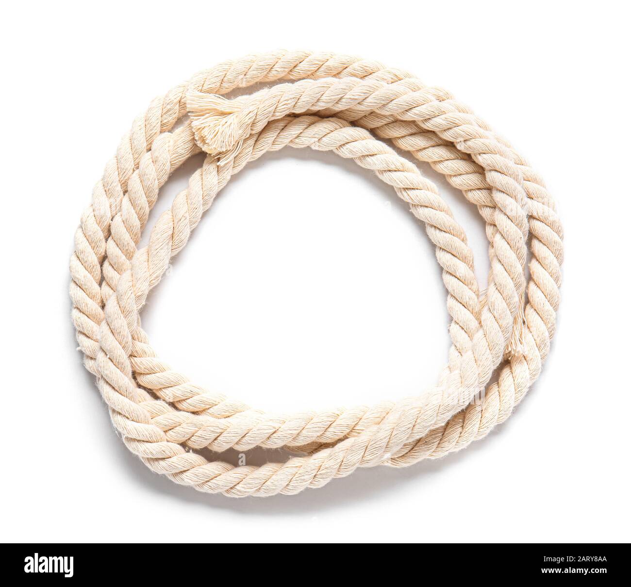 Rolled rope on white background Stock Photo - Alamy