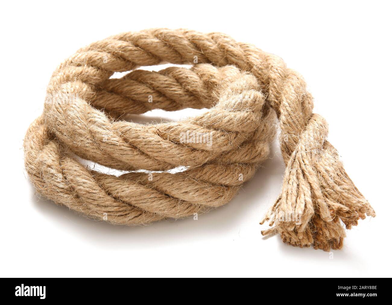 Rolled rope on white background Stock Photo - Alamy