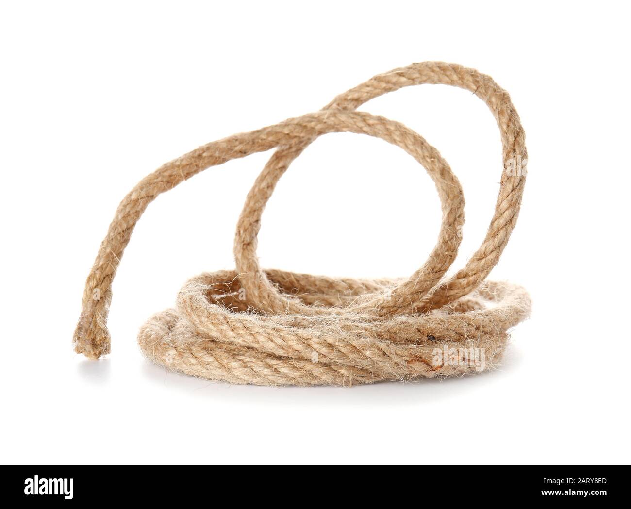 Rolled rope on white background Stock Photo - Alamy