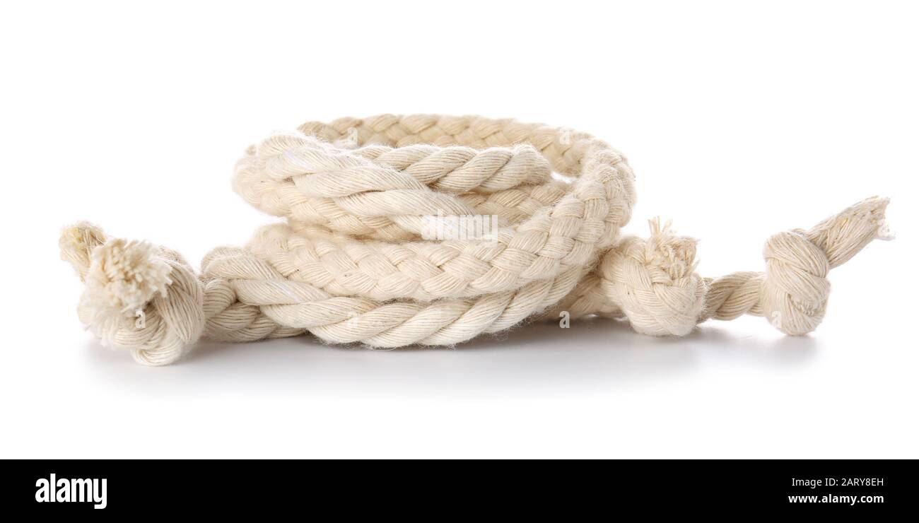 Rolled rope on white background Stock Photo - Alamy
