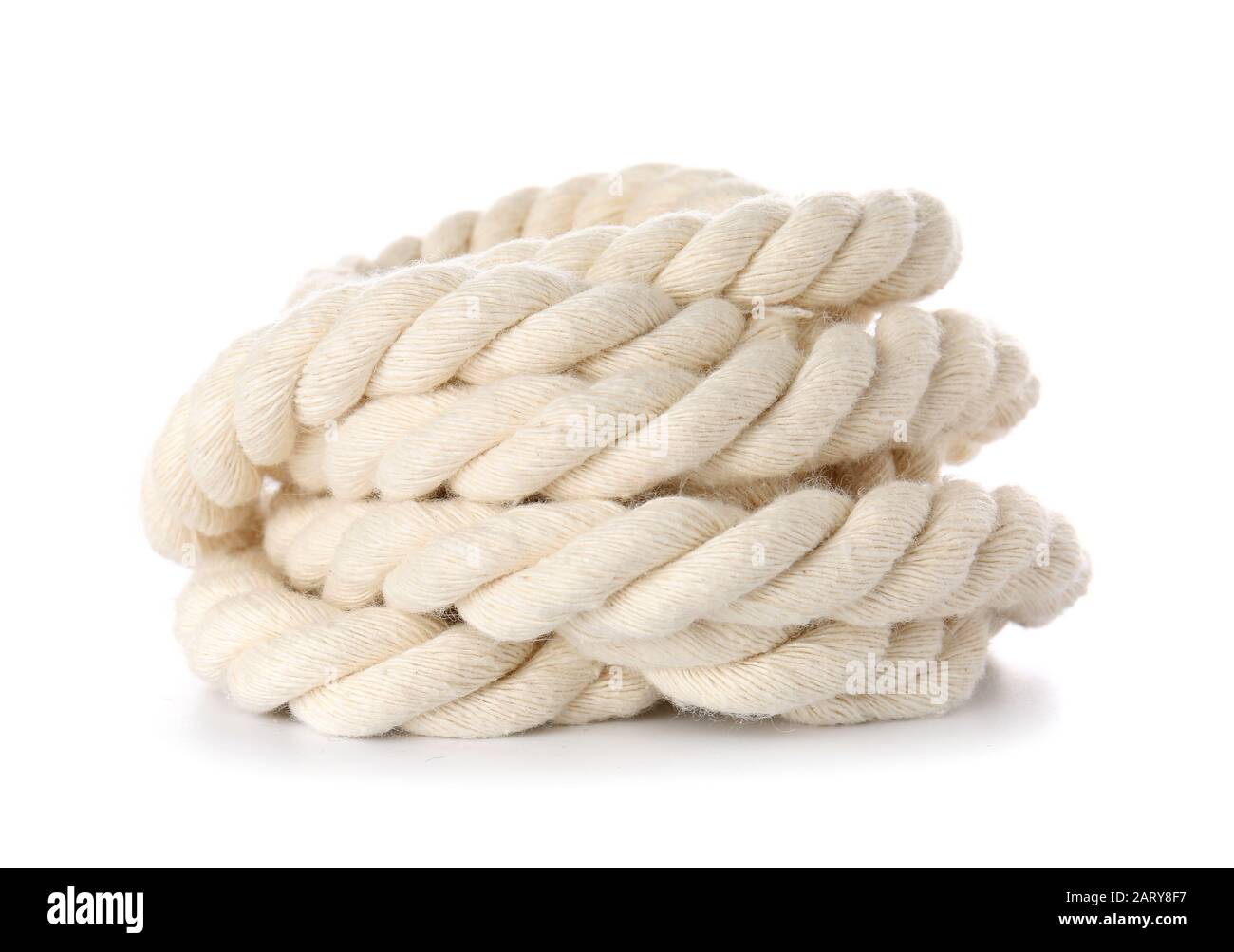 Rolled rope on white background Stock Photo - Alamy