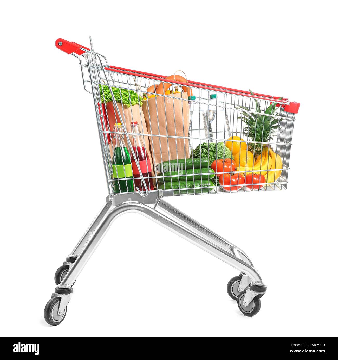 Shopping cart with products on white background Stock Photo - Alamy