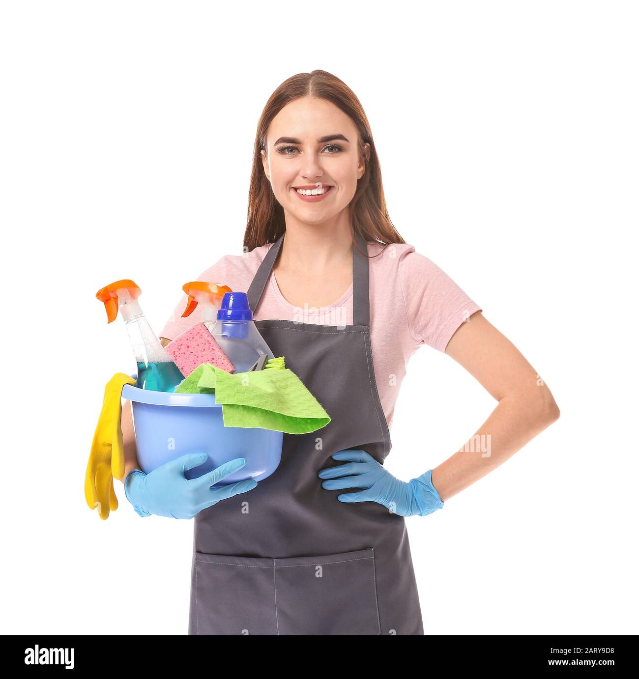 Female janitor with cleaning supplies on white background Stock Photo ...