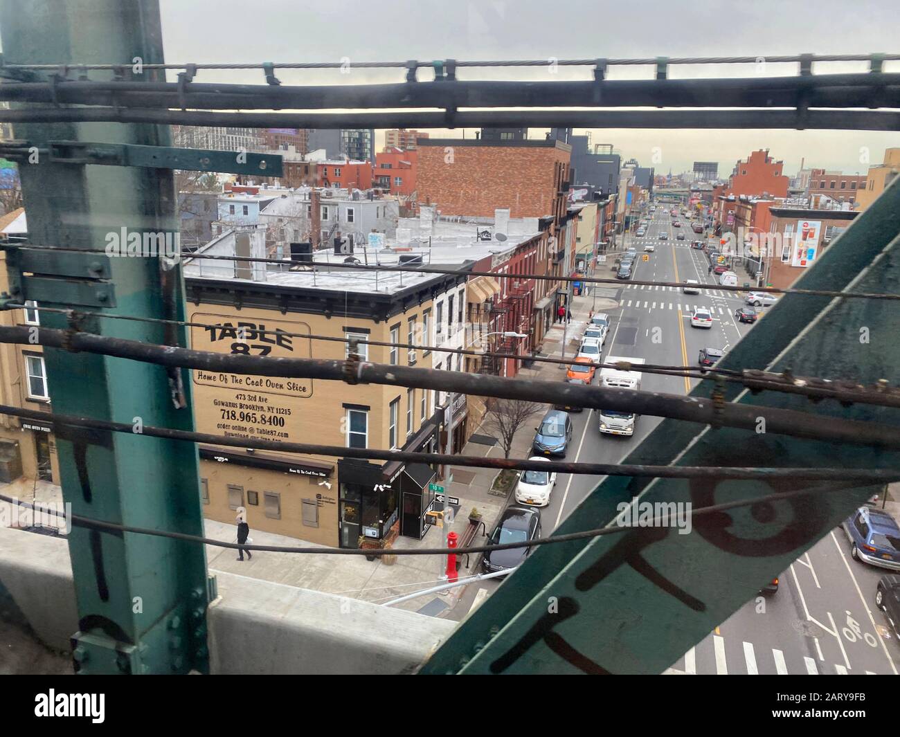 Looking out from an elevated F subway train crossing over Third Avenue ...