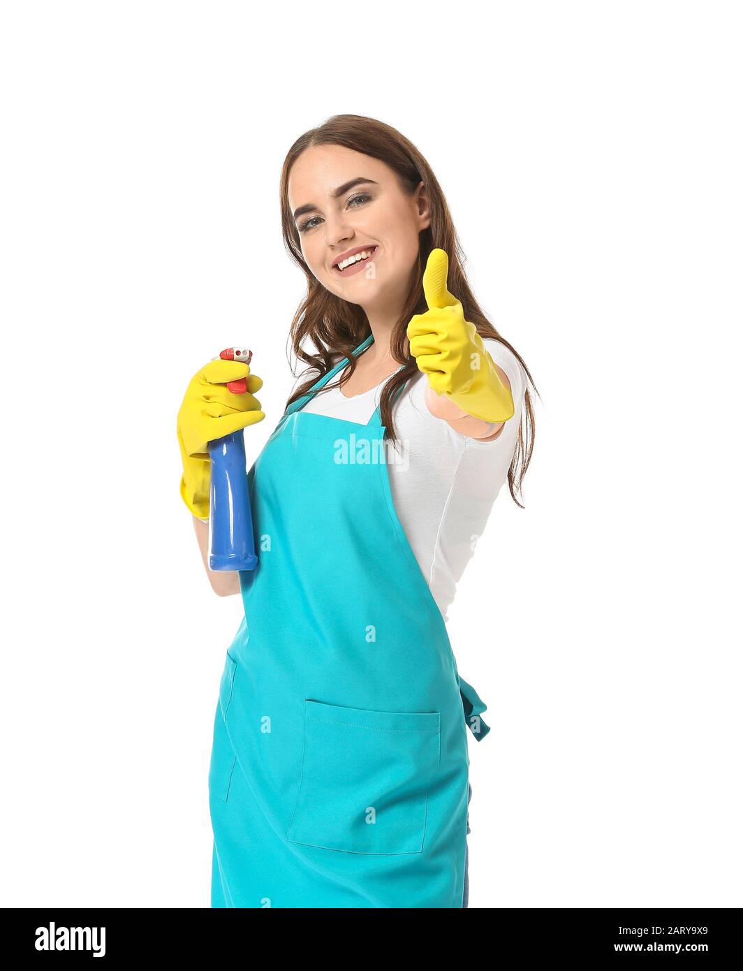 Female janitor showing thumb-up gesture on white background Stock Photo ...