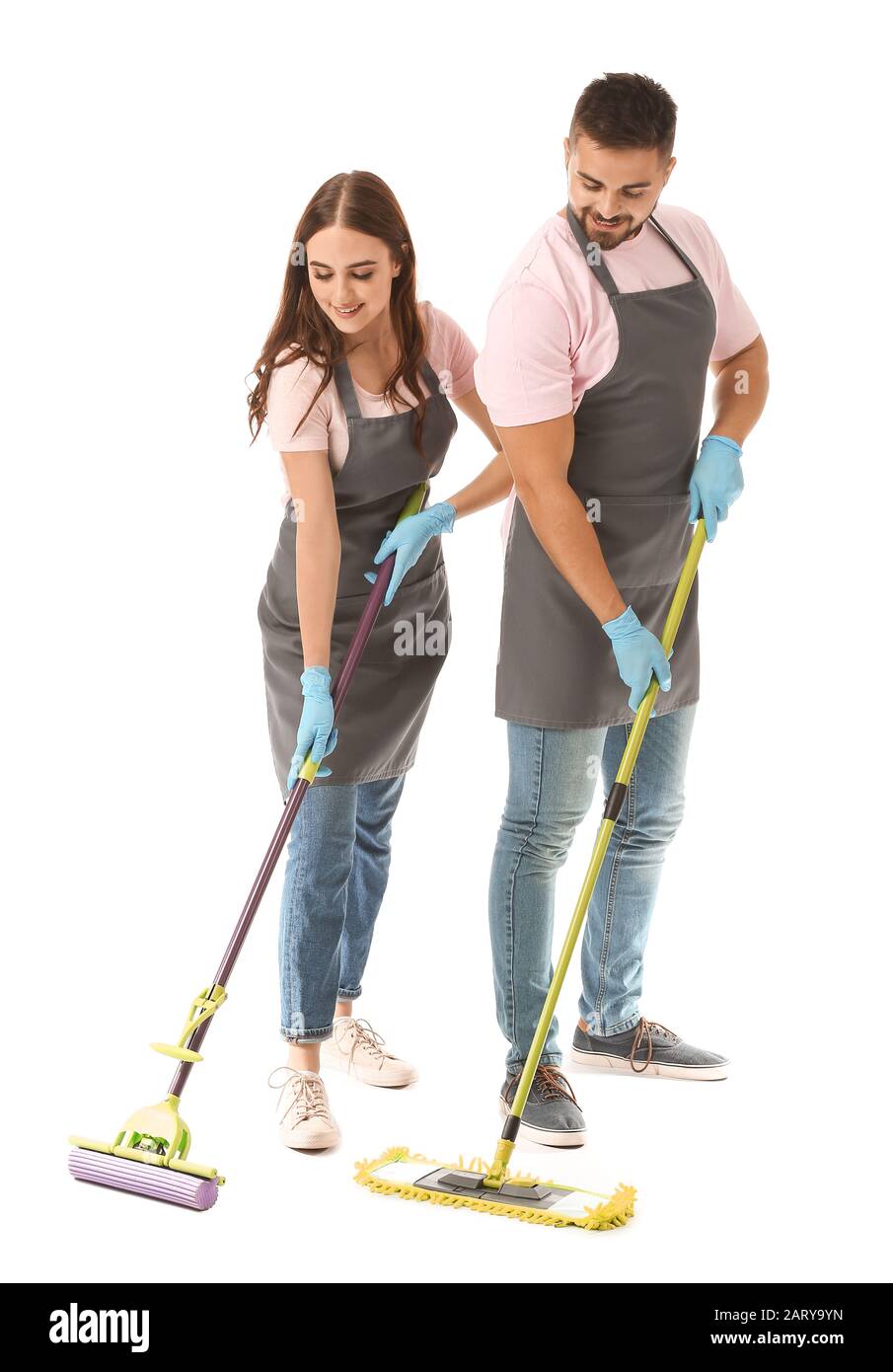 Team of janitors with floor mops on white background Stock Photo - Alamy