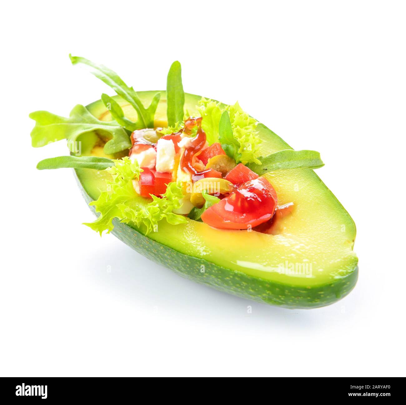 Tasty avocado with filling on white background Stock Photo - Alamy