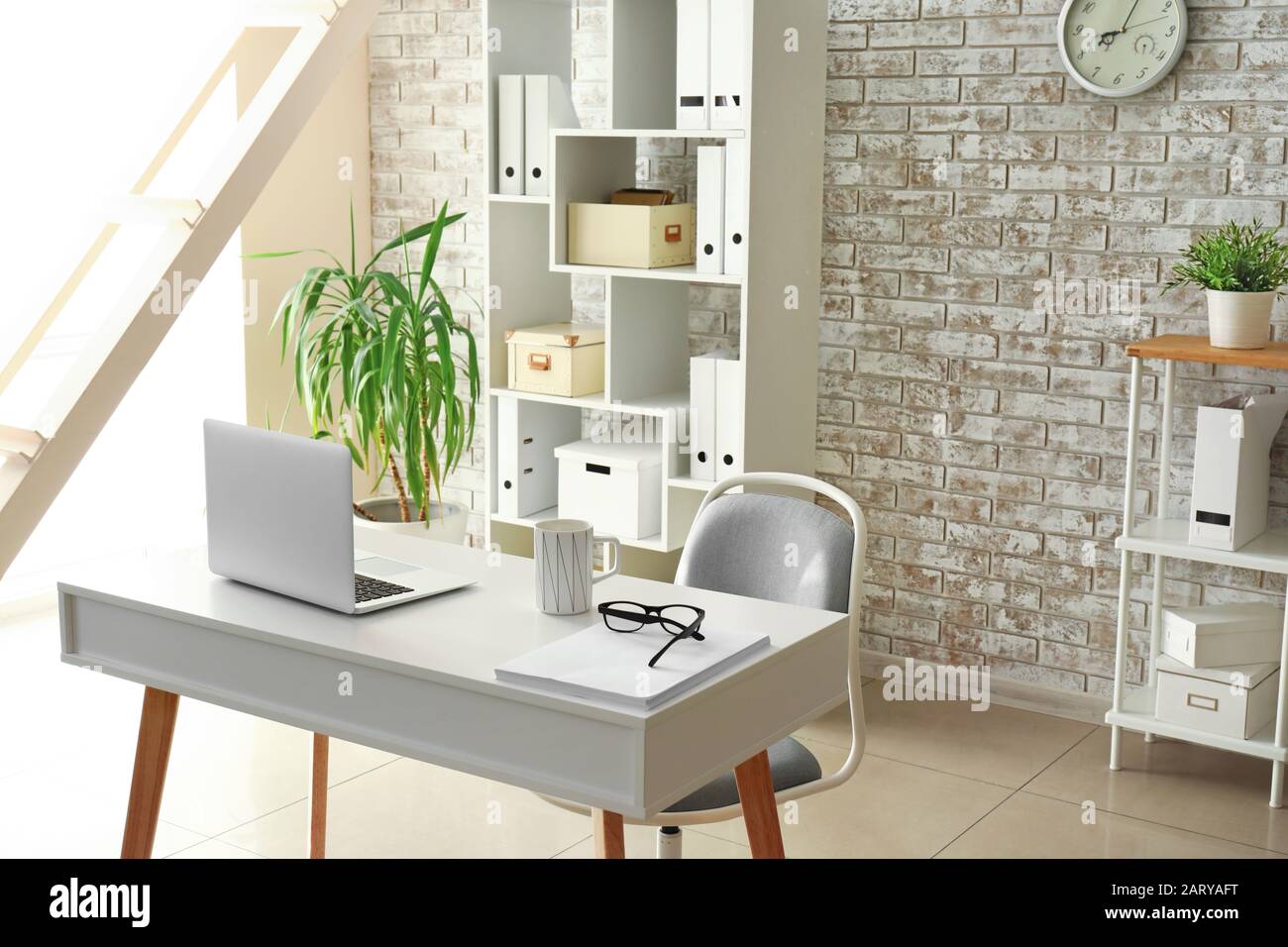 Interior of room with comfortable workplace Stock Photo - Alamy