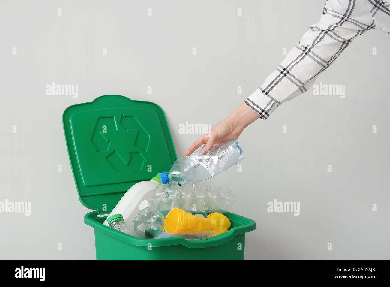 Woman throwing garbage hi-res stock photography and images - Alamy