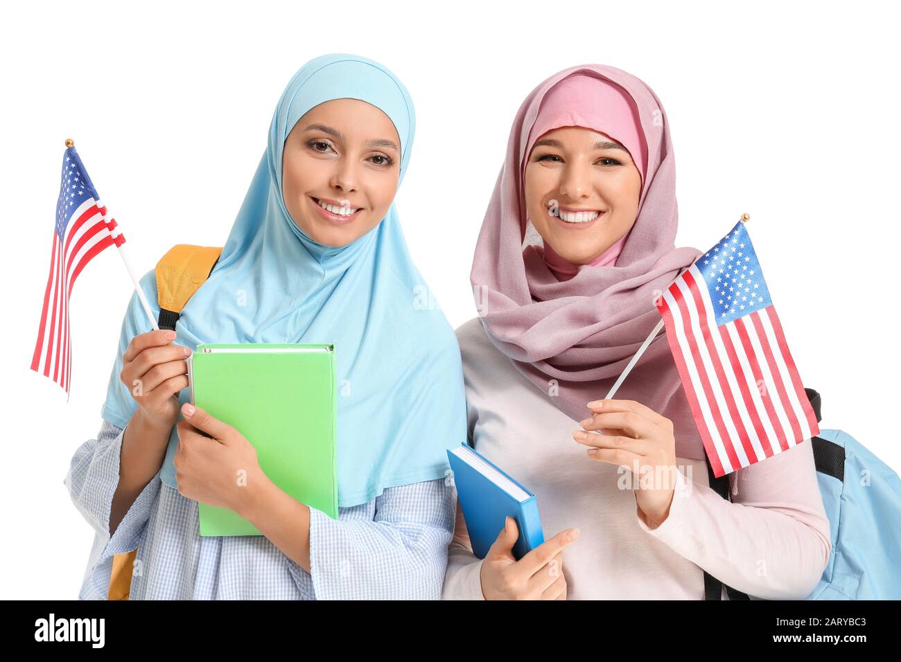 Female Muslim students with USA flags on white background Stock Photo ...