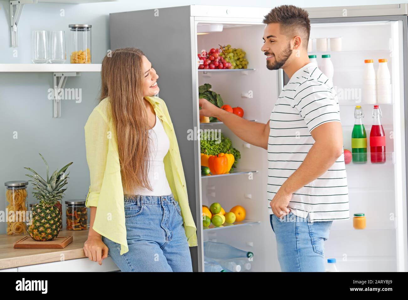 Man eating out of fridge hi-res stock photography and images - Alamy
