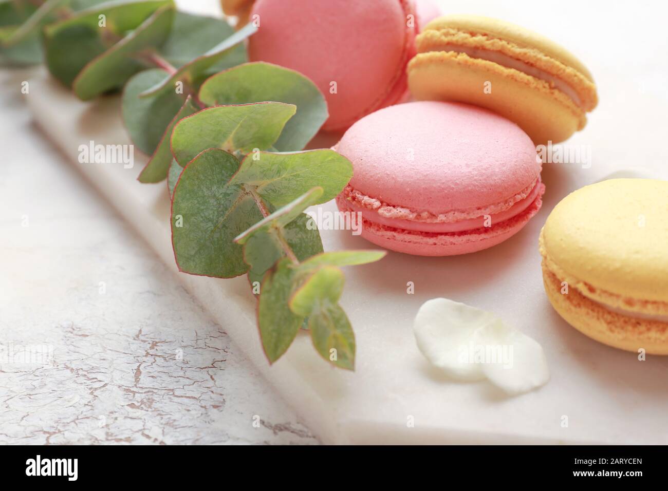 Different tasty macarons on white background Stock Photo - Alamy