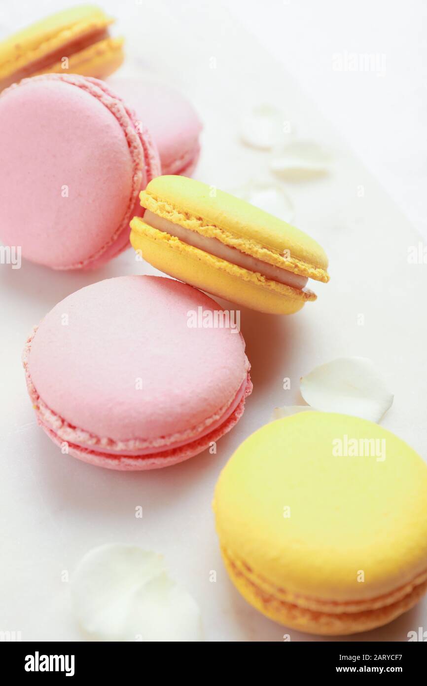Different tasty macarons on white background Stock Photo - Alamy