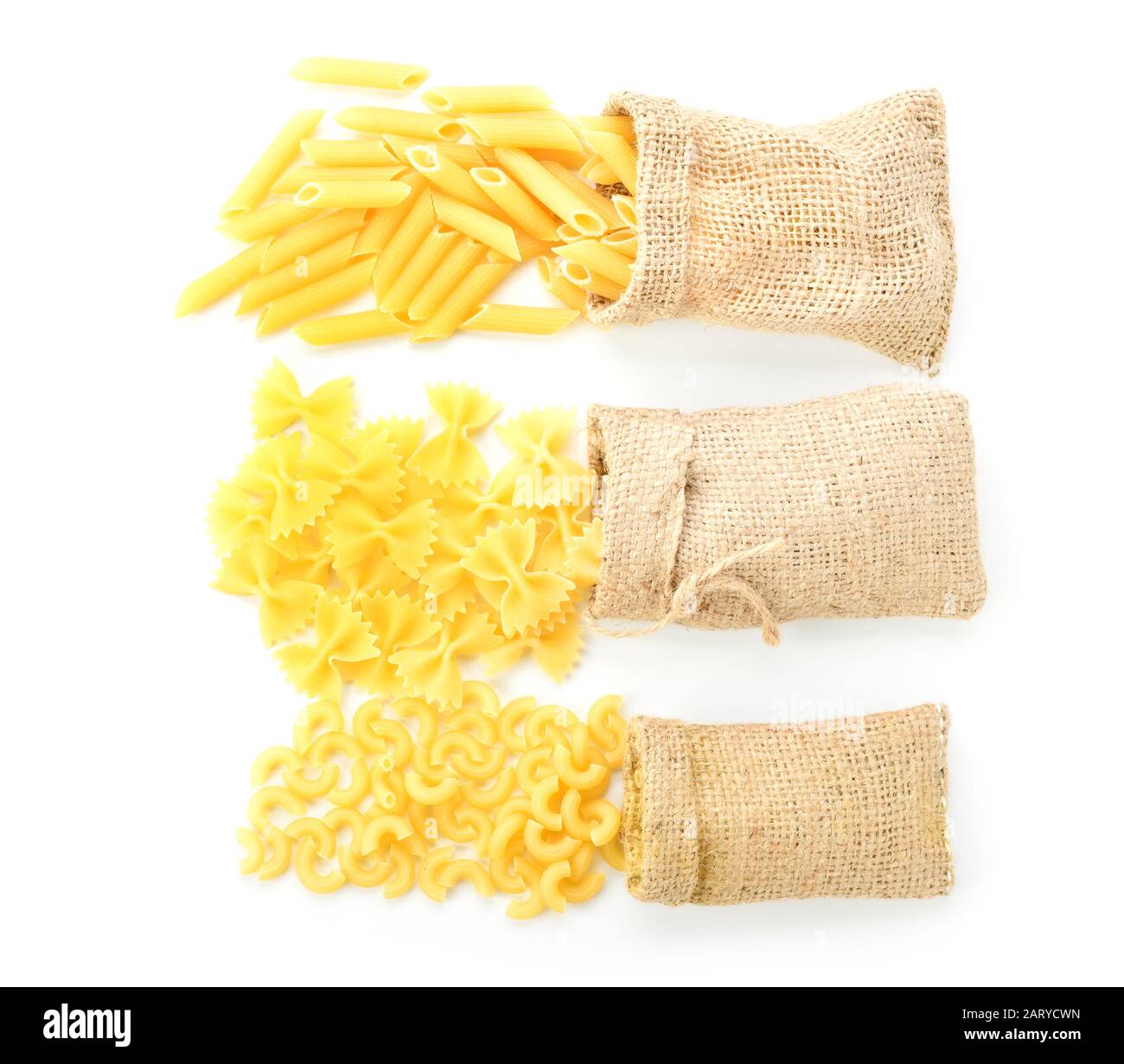 Bags with different uncooked pasta on white background Stock Photo - Alamy