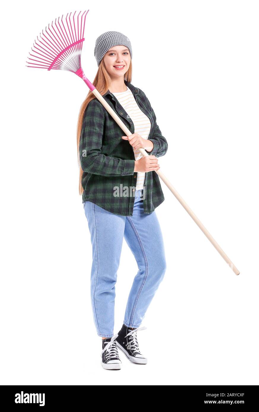 Woman with rake for autumn leaves clean-up on white background Stock ...