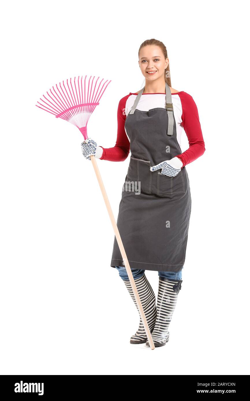 Woman with rake for autumn leaves clean-up on white background Stock ...