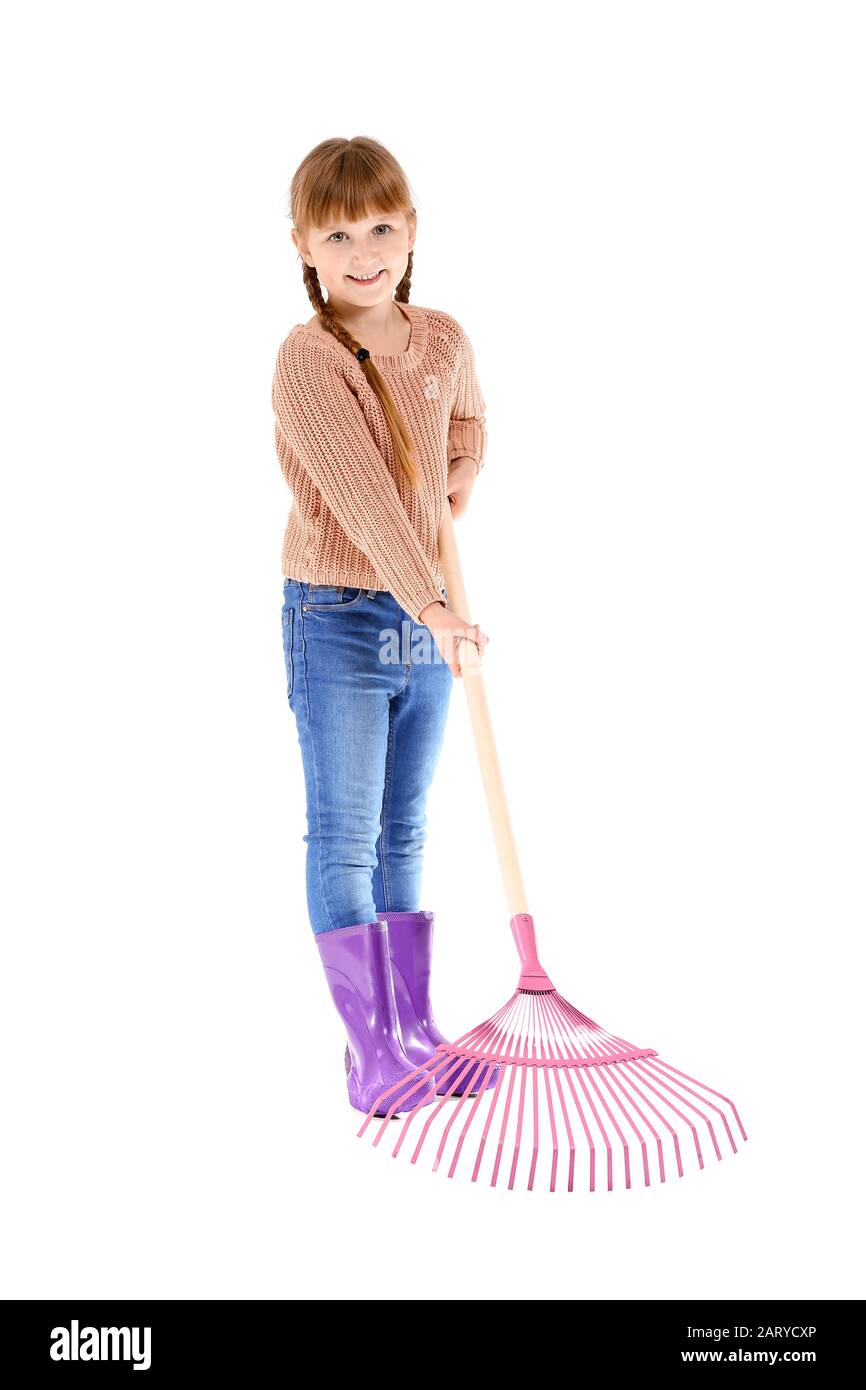 Little girl with rake for autumn leaves clean-up on white background ...