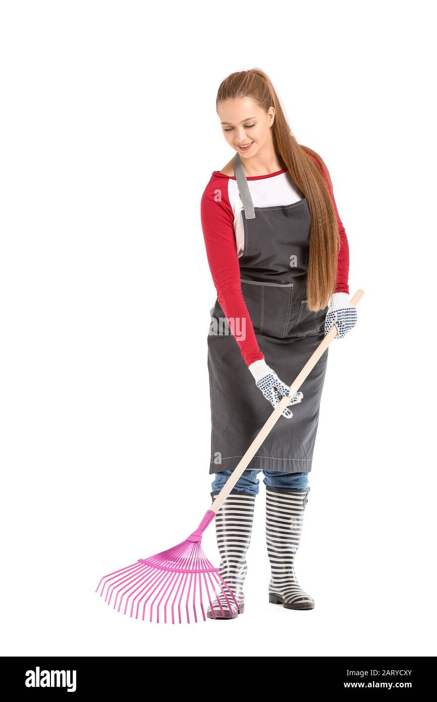 Woman with rake for autumn leaves clean-up on white background Stock ...
