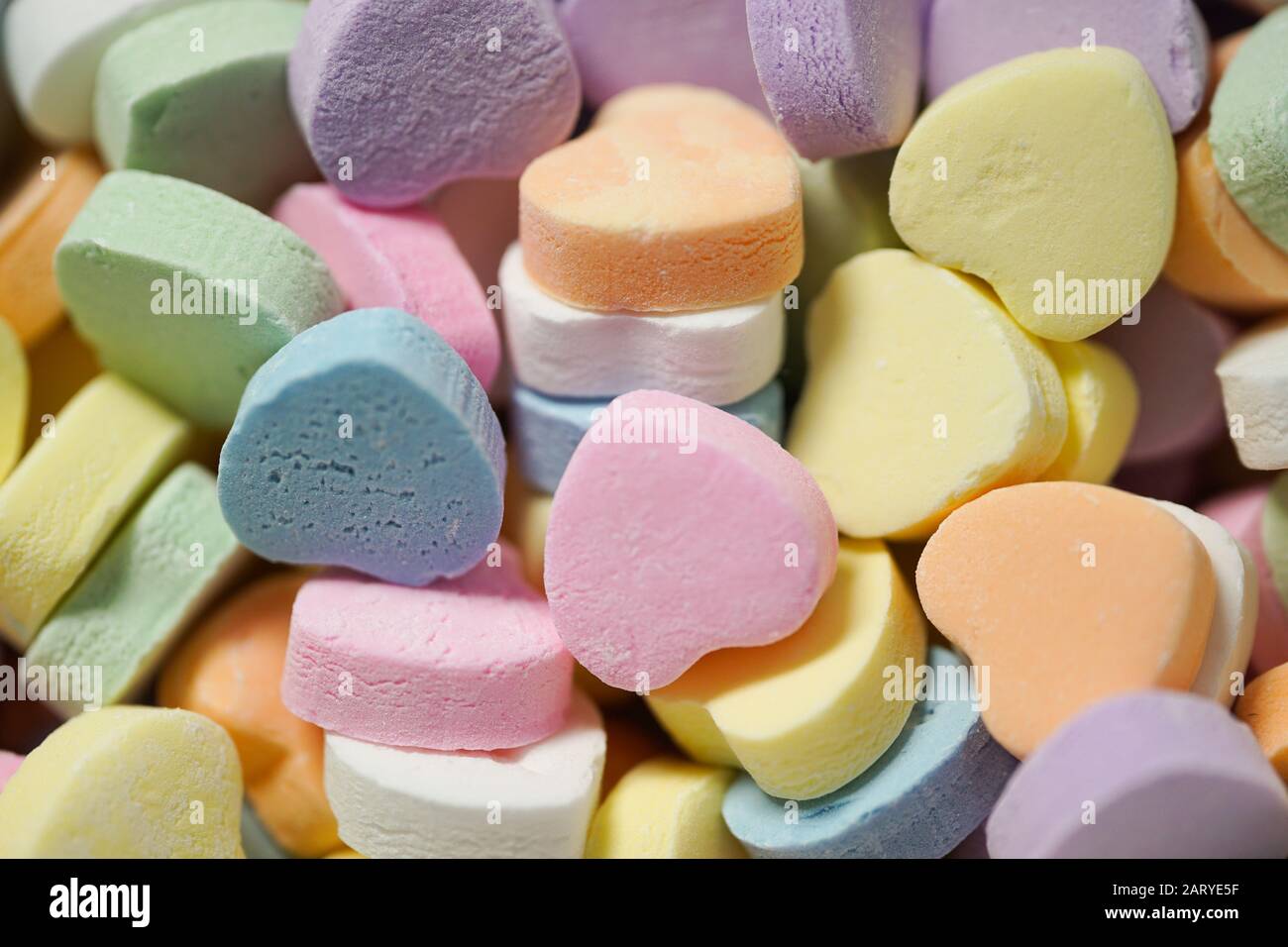 Bowl of pastel-colored candy hearts for Valentine's Day. These are ...