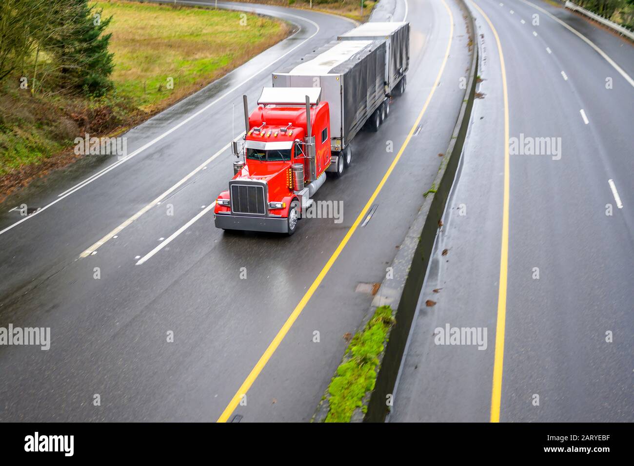 Red big rig heavy-duty long haul diesel semi truck with spoiler ...