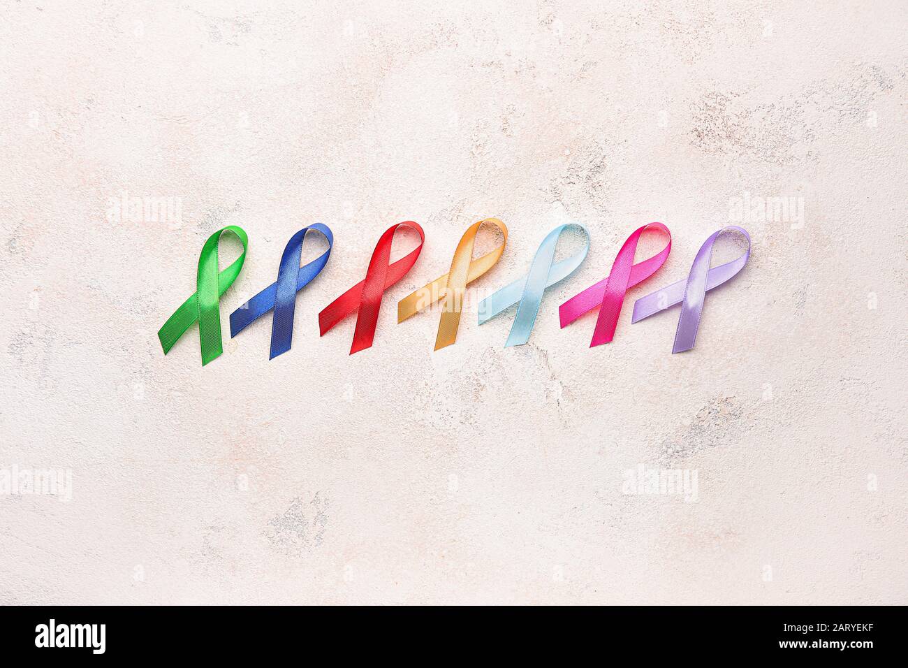 Different awareness ribbons on grey background Stock Photo - Alamy