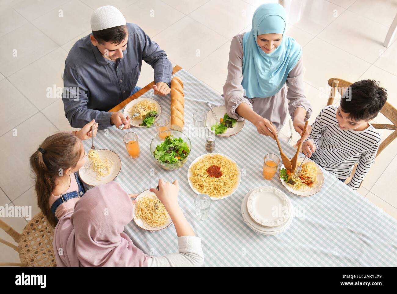 Muslim family having dinner at home Stock Photo - Alamy