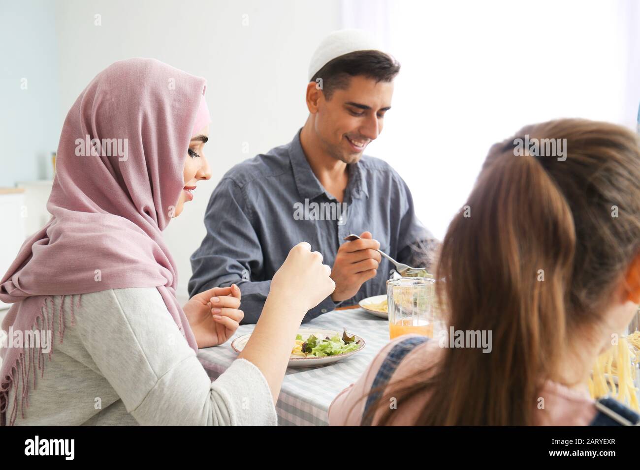 Muslim family having dinner at home Stock Photo - Alamy