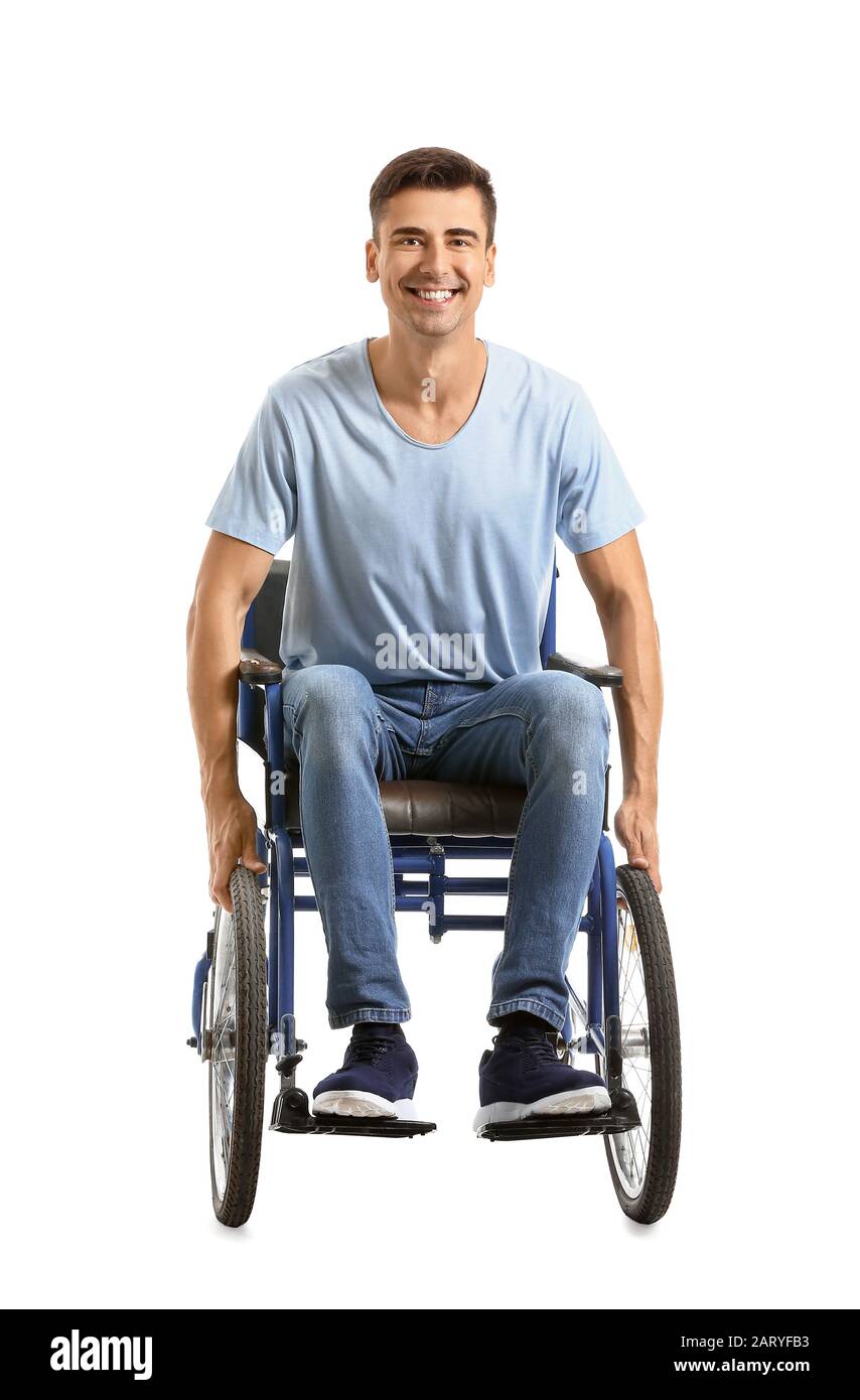 Handicapped young man in wheelchair on white background Stock Photo - Alamy