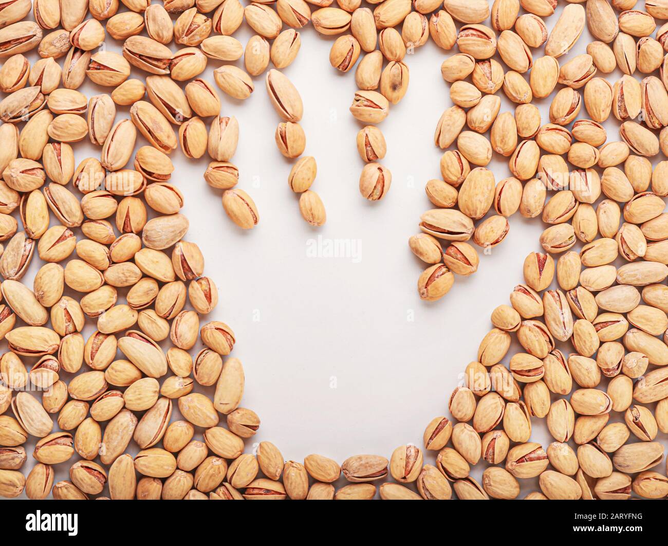 Human palm print made of tasty pistachio nuts on white background Stock ...