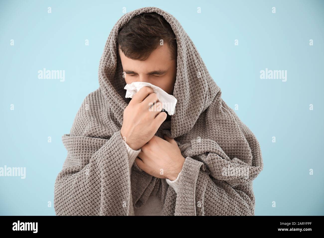 Portrait of sick man on color background Stock Photo - Alamy