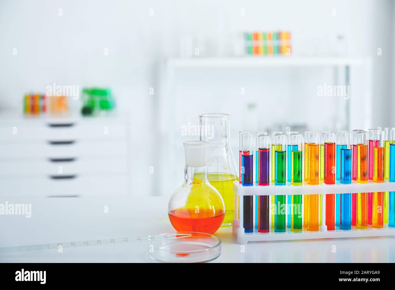 Glassware with colorful samples in laboratory Stock Photo - Alamy