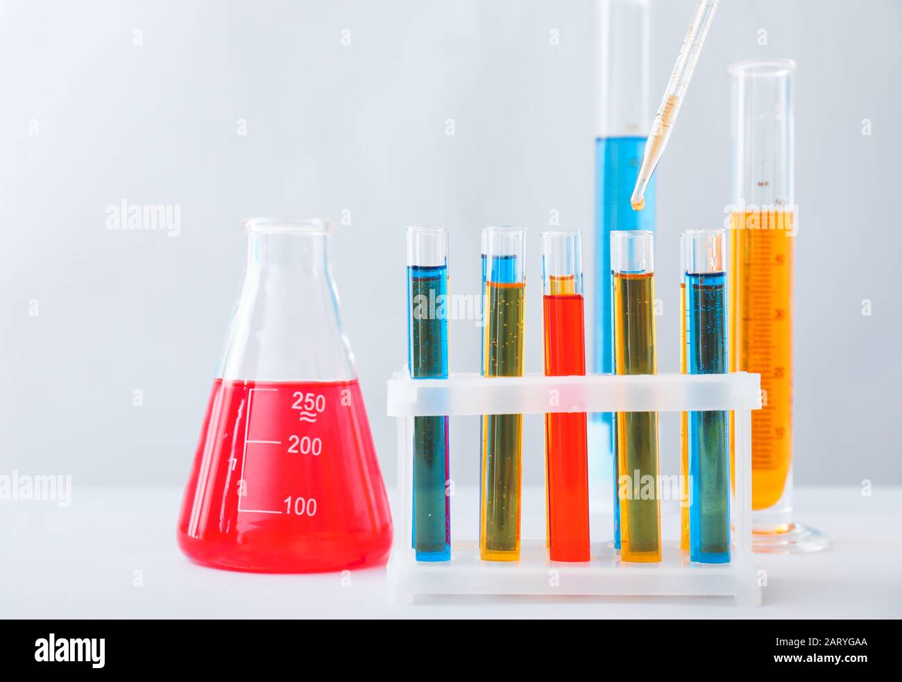 Test tubes and flask with colorful samples in laboratory Stock Photo ...