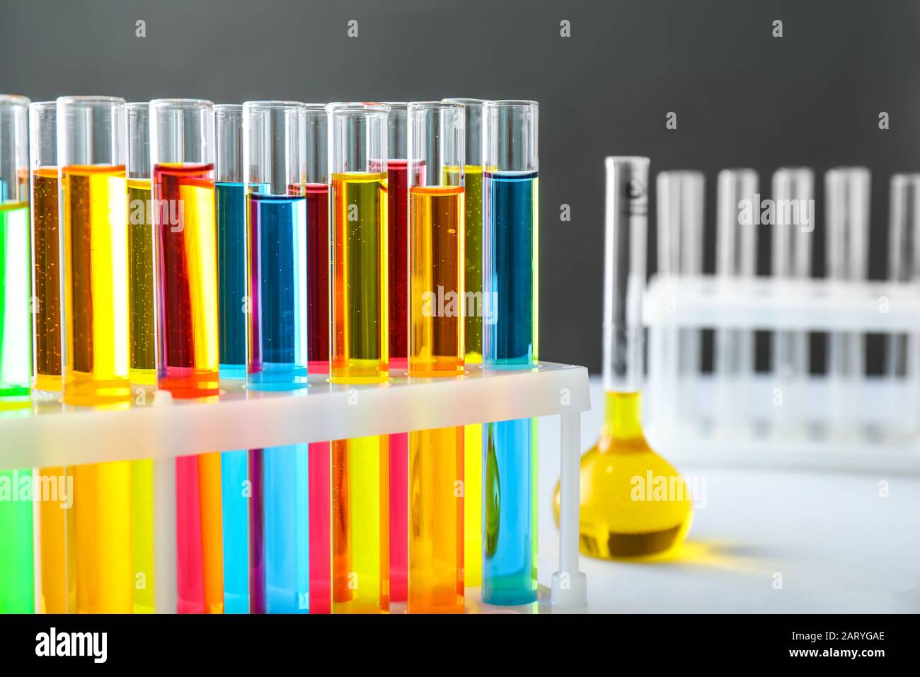 Test tubes with colorful samples in laboratory Stock Photo - Alamy