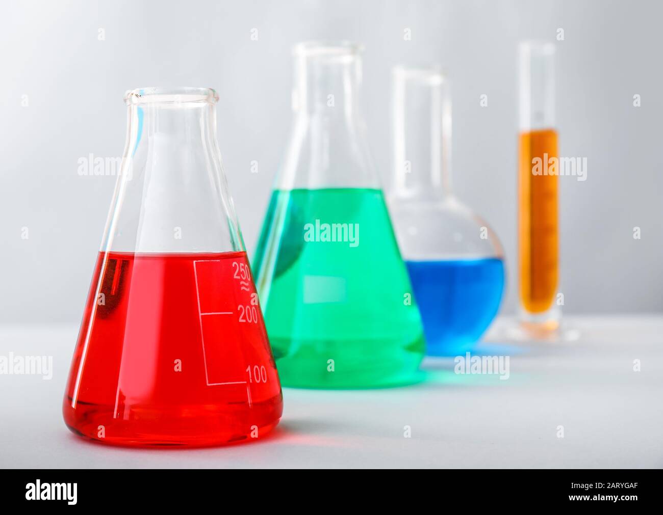 Flasks with colorful samples in laboratory Stock Photo - Alamy
