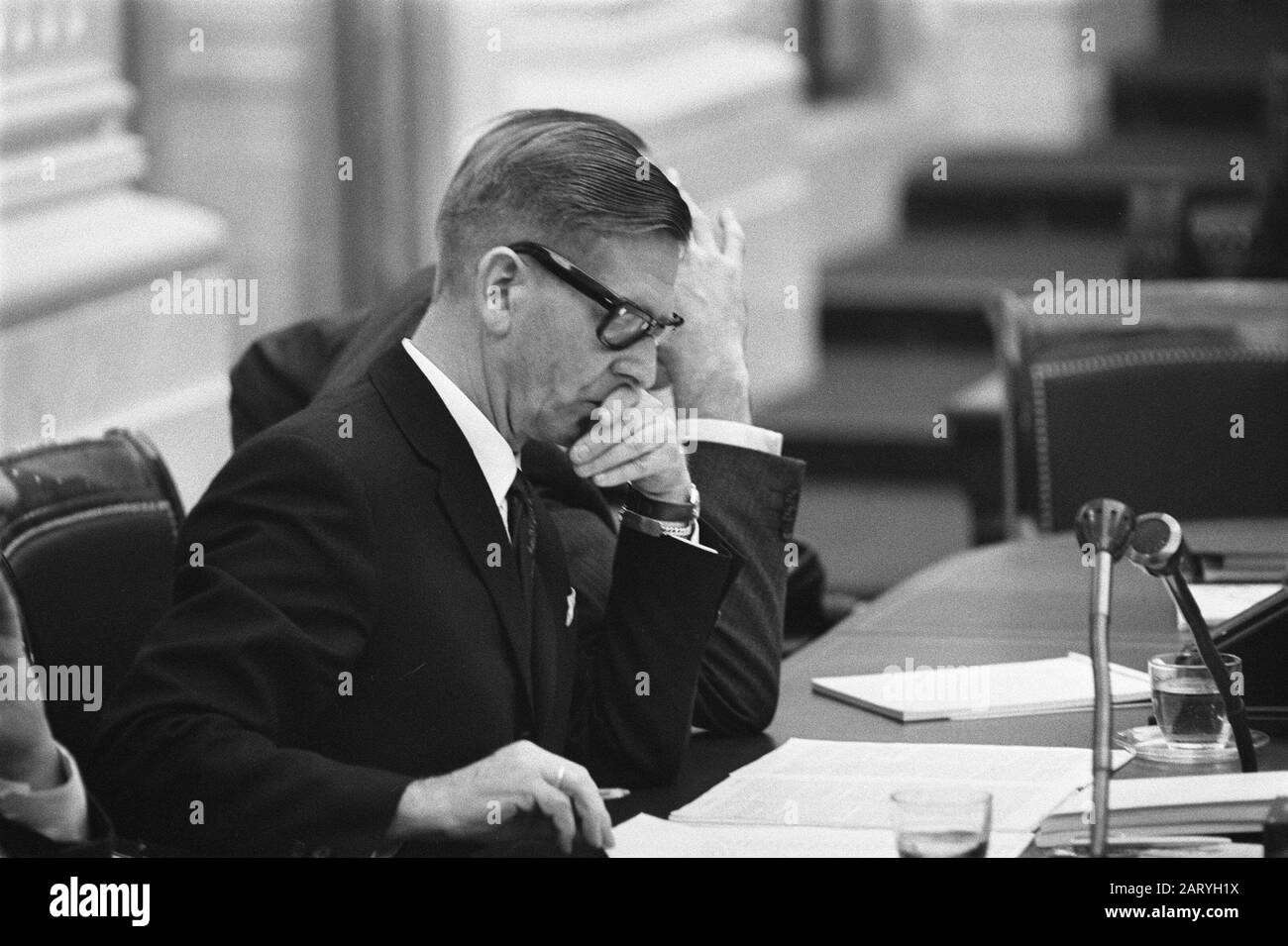 Second Chamber of Defence Budget. Minister Den Toom with hand to mouth ...