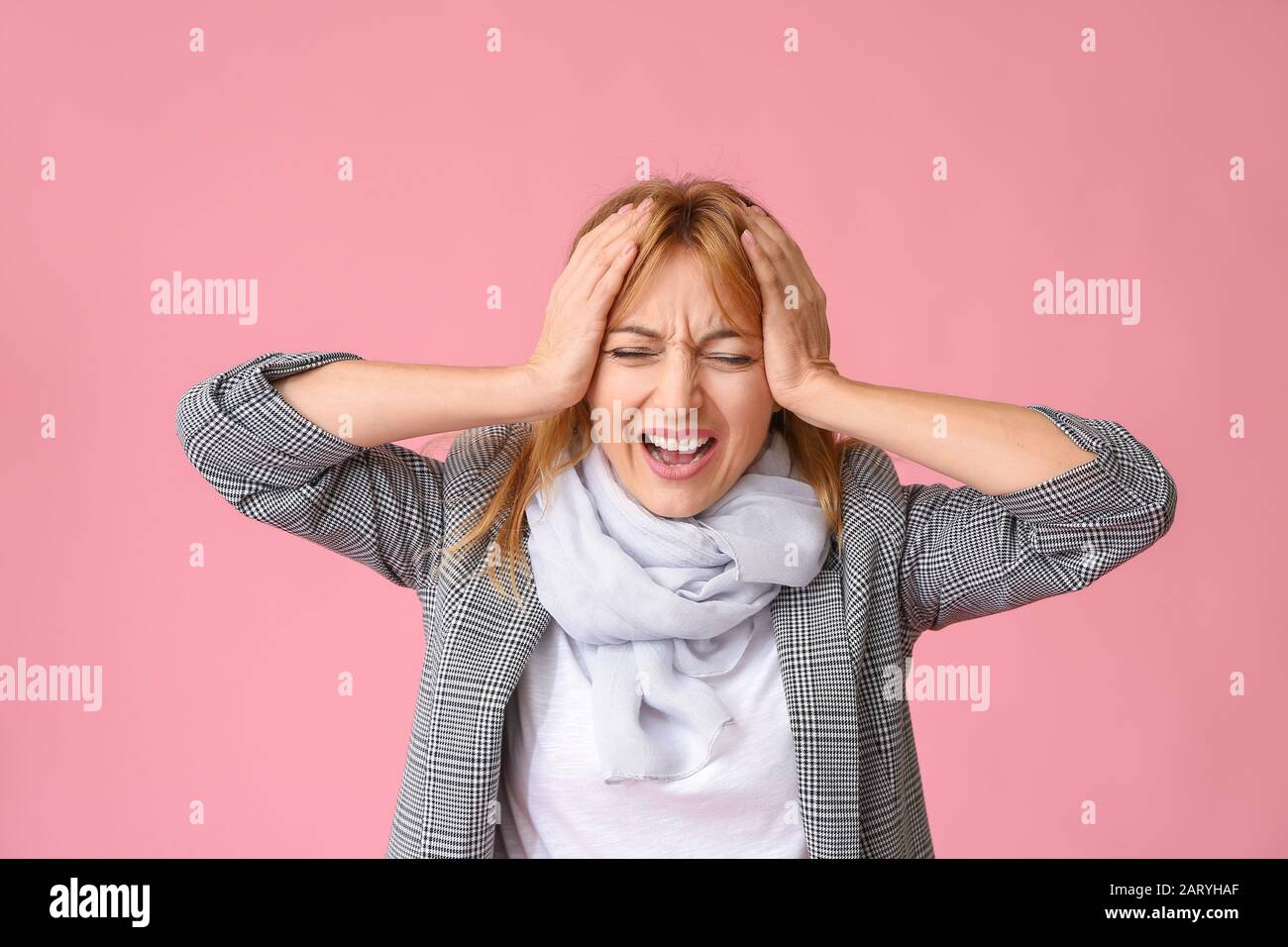 Stressed mature woman on color background Stock Photo - Alamy