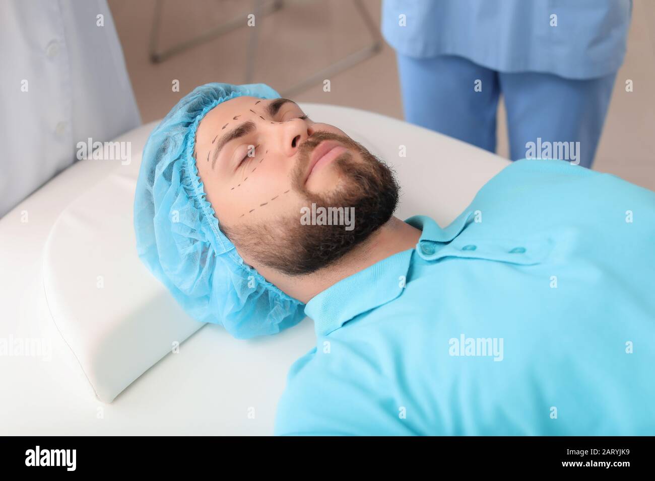 Handsome man in clinic of plastic surgery Stock Photo - Alamy