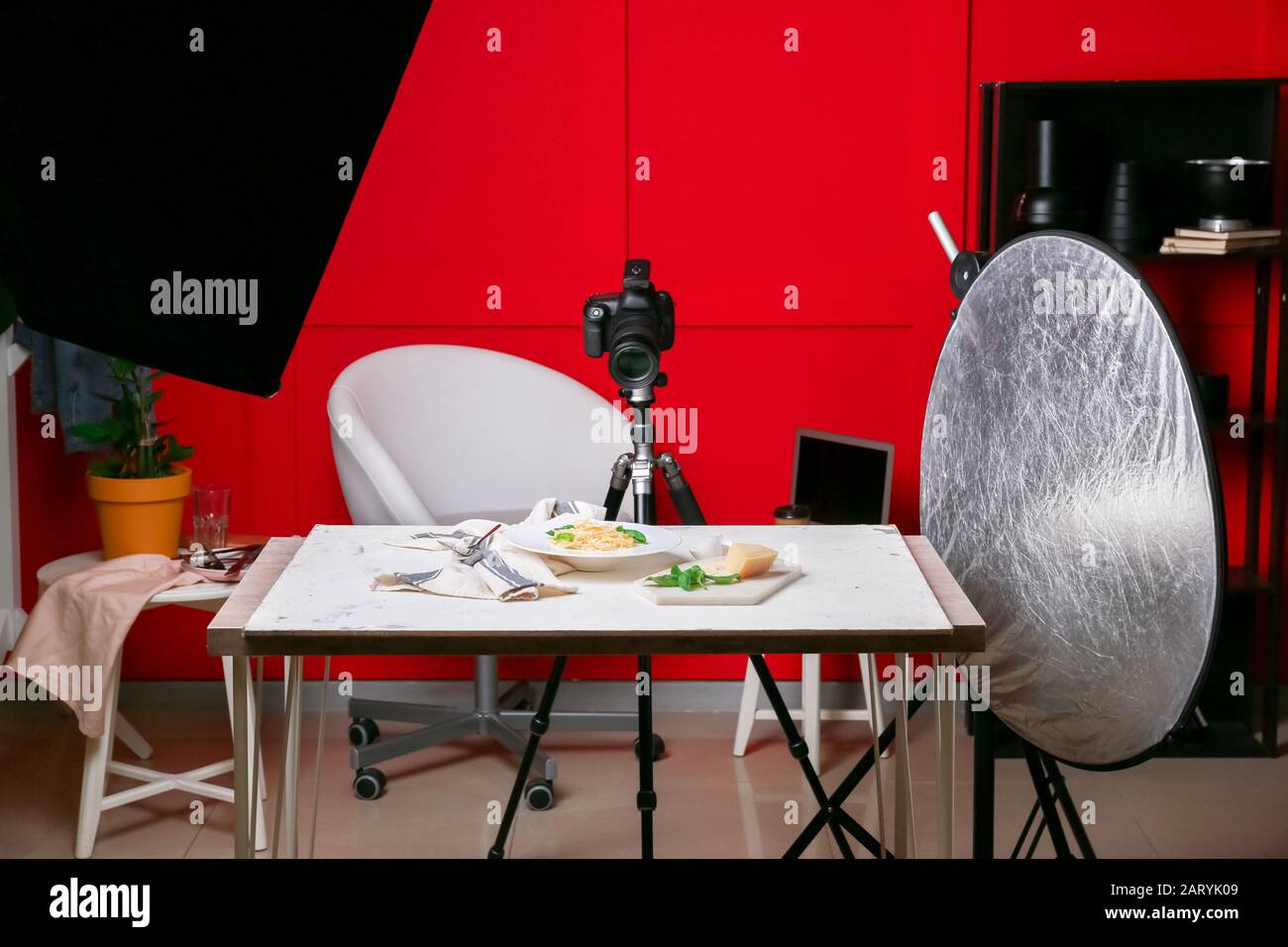 Interior of modern photo studio with professional equipment and food on ...
