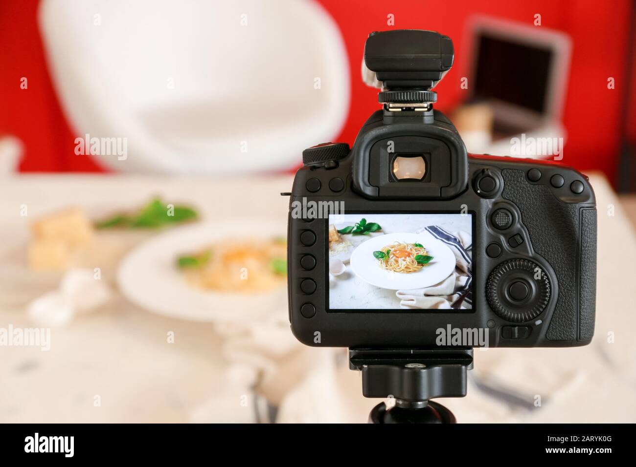 Tasty pasta on display of professional photo camera in studio Stock ...