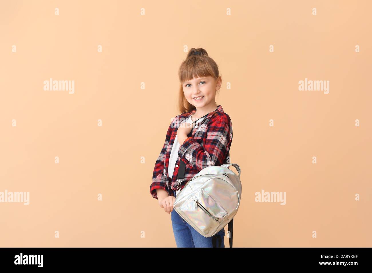 Cute little girl on color background Stock Photo - Alamy
