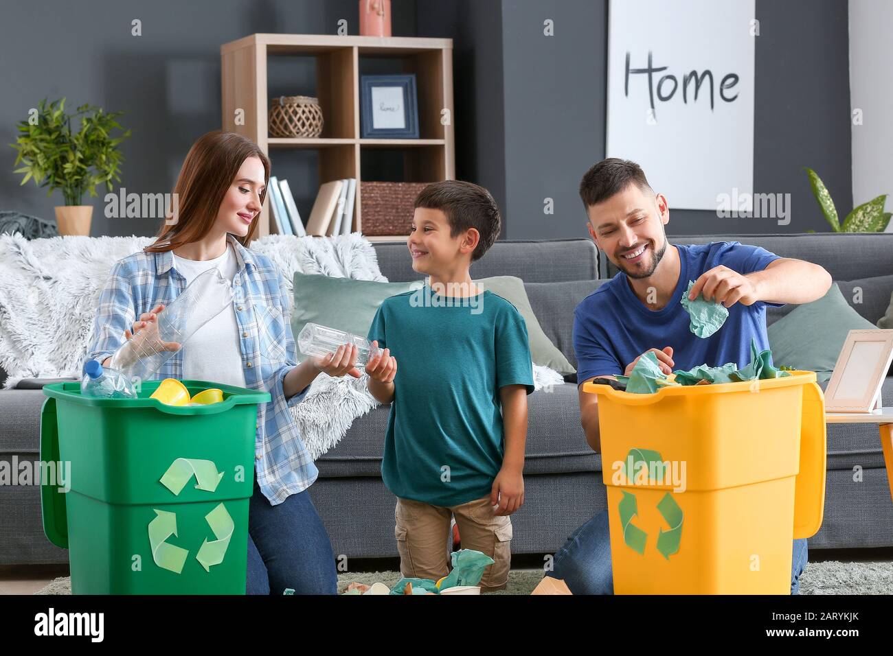 Family sorting garbage at home. Concept of recycling Stock Photo - Alamy