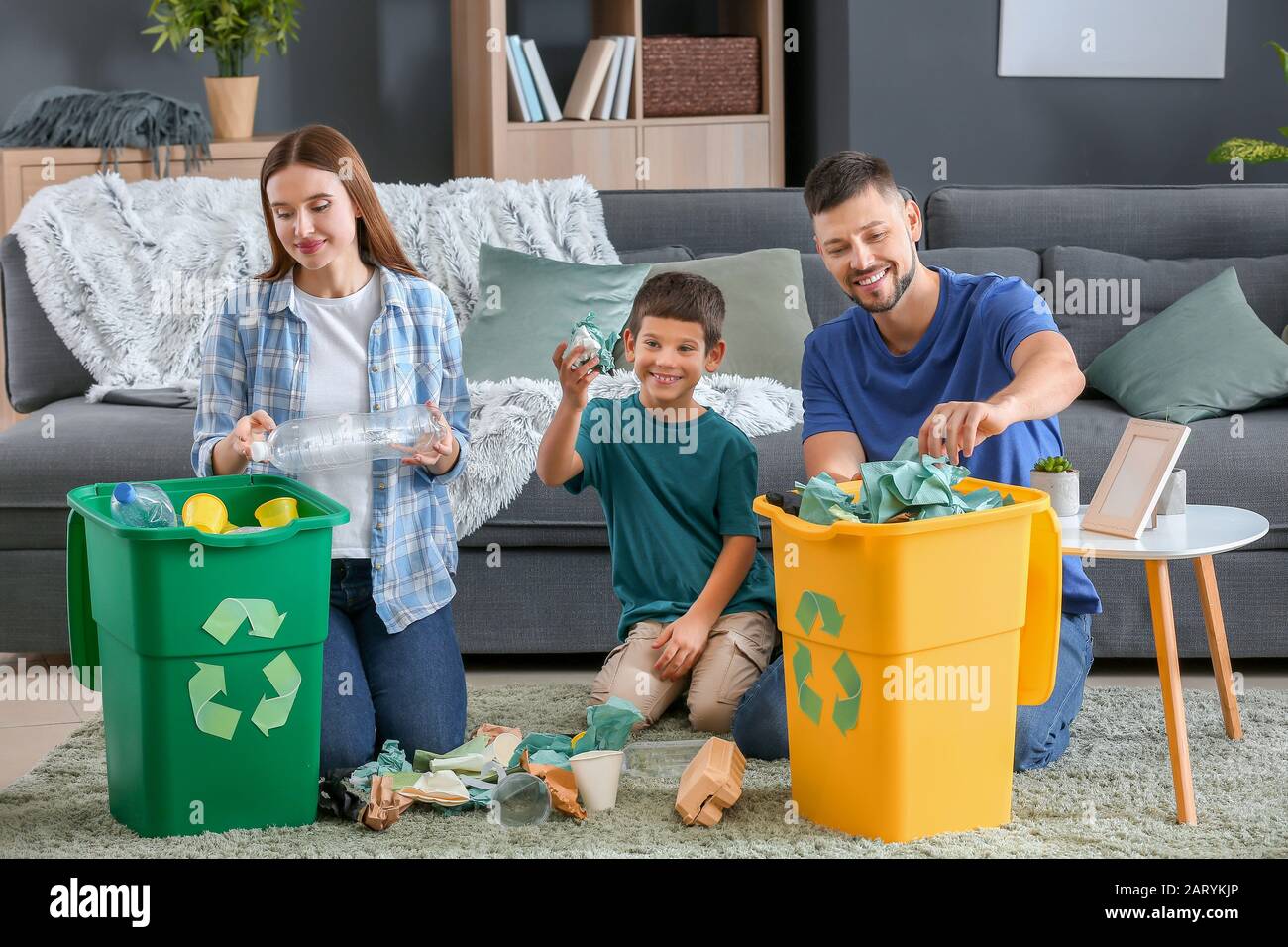 Family sorting garbage at home. Concept of recycling Stock Photo - Alamy