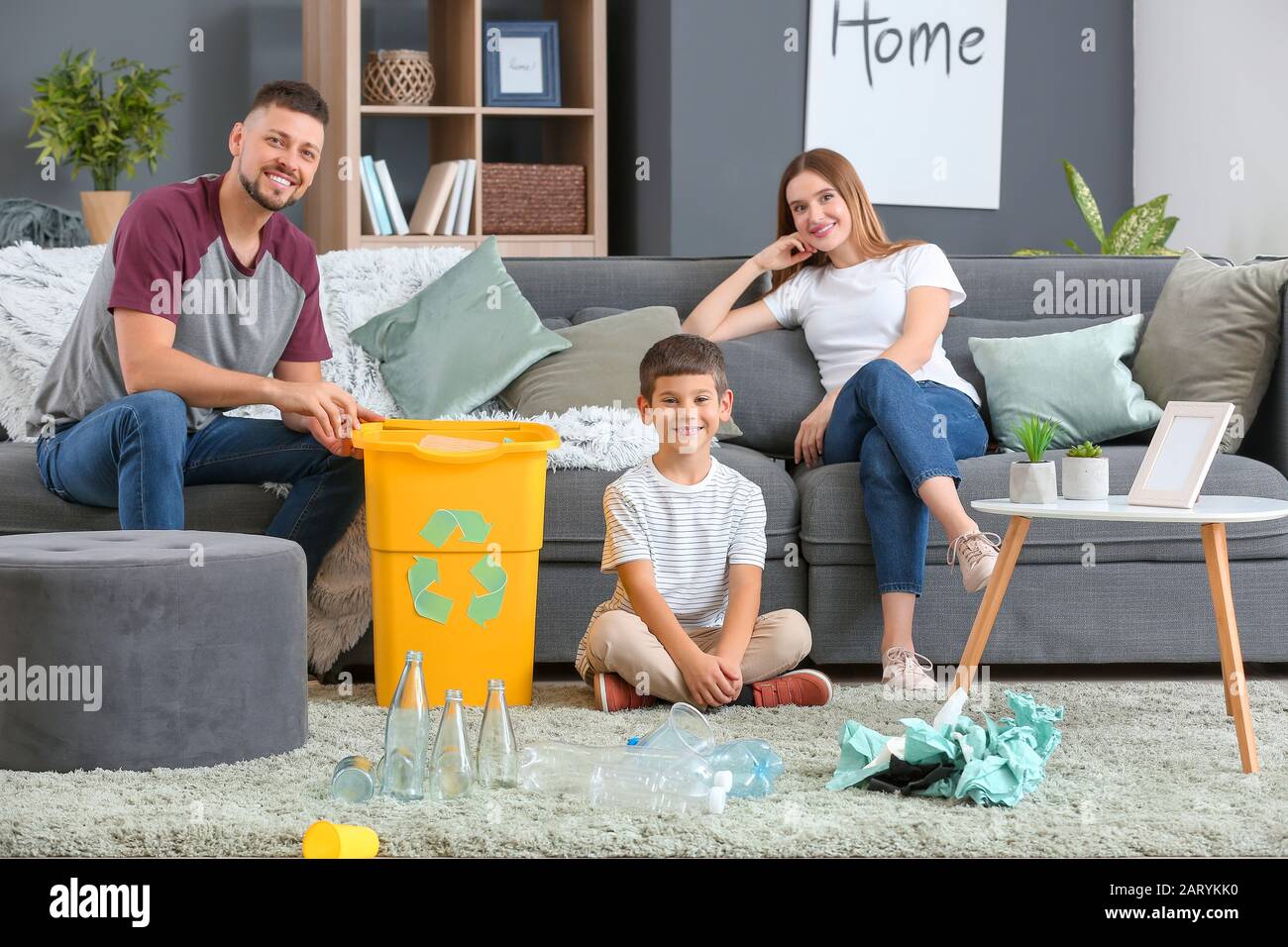 Family with garbage and container at home. Concept of recycling Stock ...
