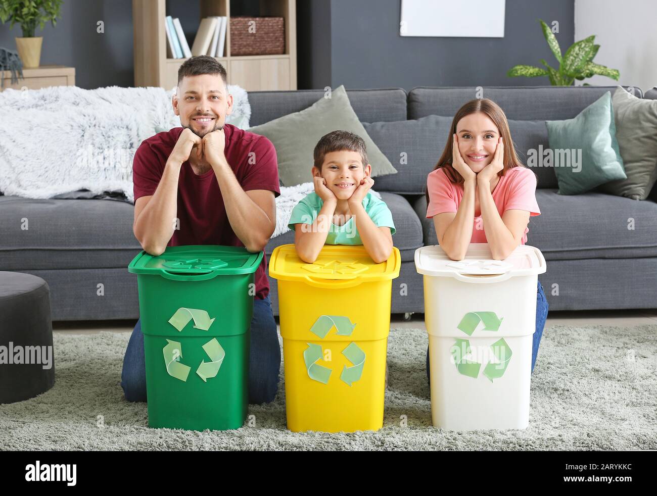 Family with containers for garbage at home. Concept of recycling Stock ...