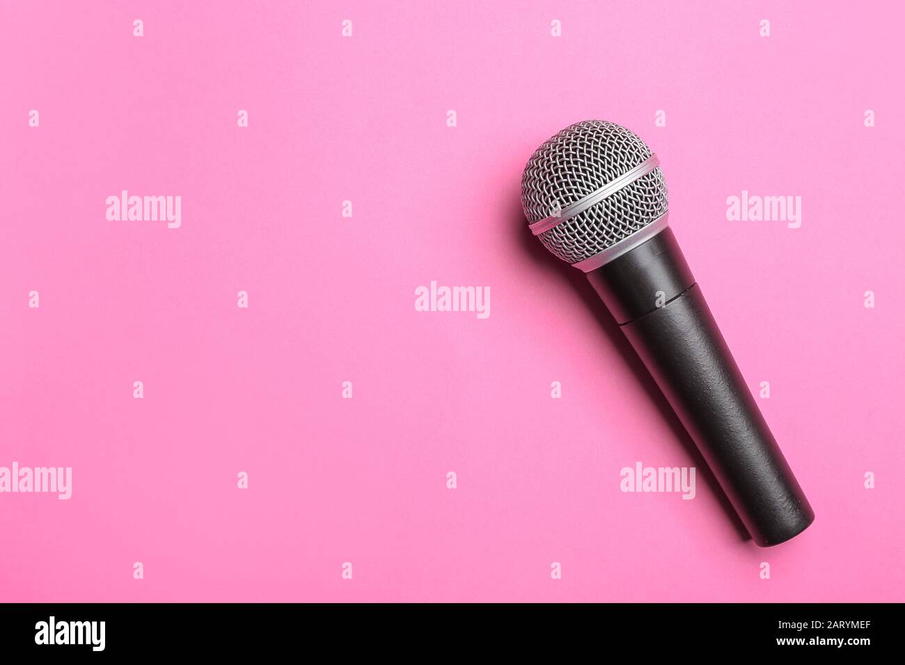 Modern microphone on color background Stock Photo - Alamy