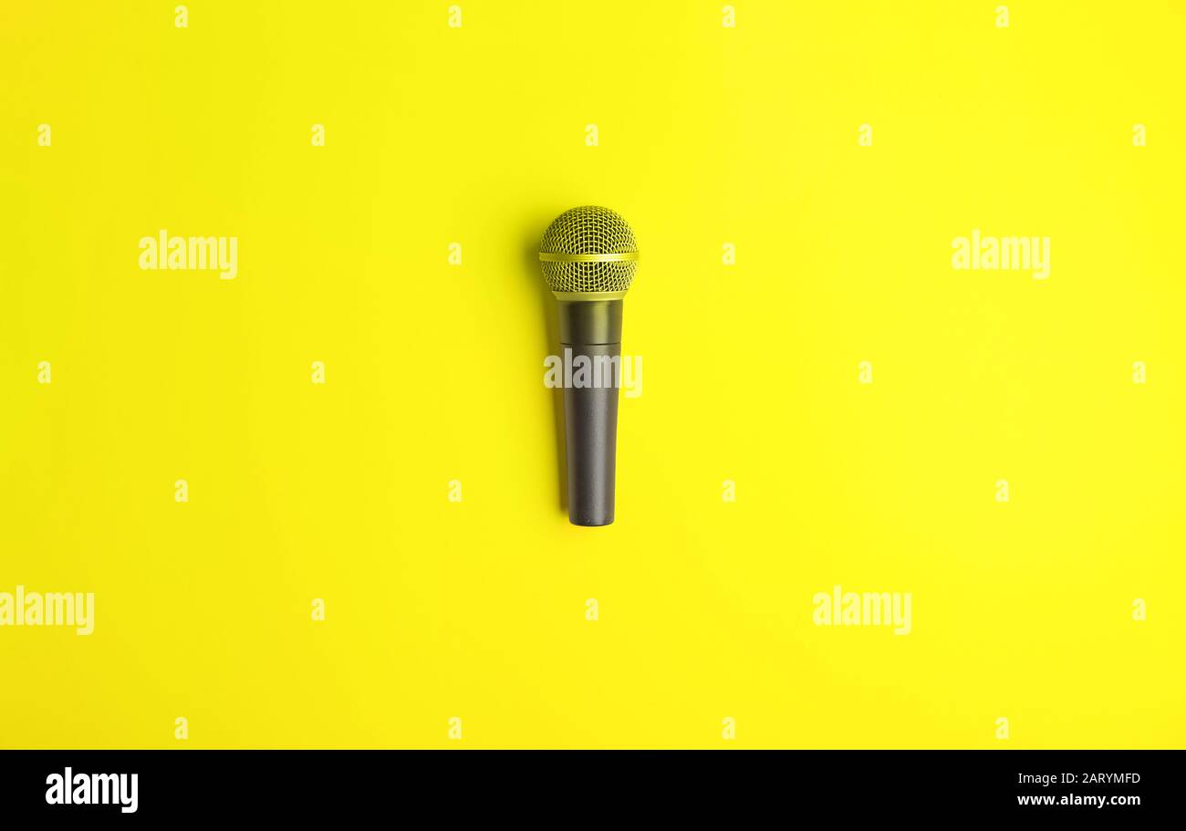 Modern microphone on color background Stock Photo - Alamy