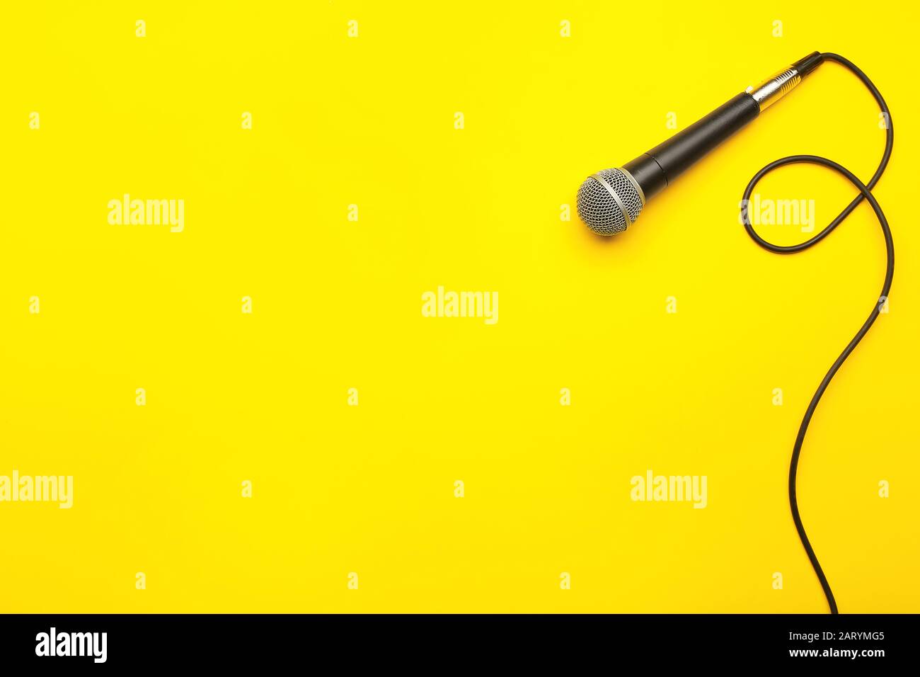 Modern microphone on color background Stock Photo - Alamy