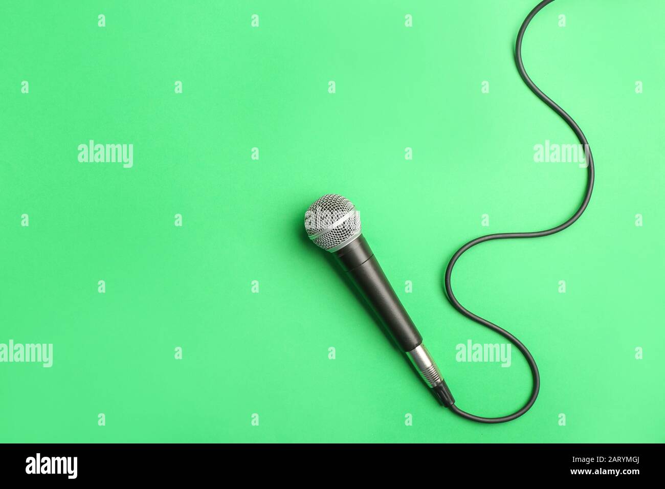 Modern microphone on color background Stock Photo - Alamy